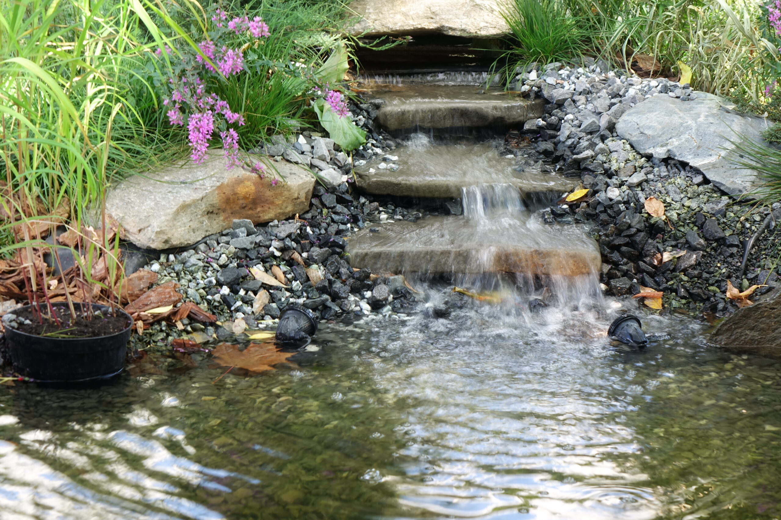 Spring Gravel Projects: Backyard Ponds and Waterfalls - HK Contractors